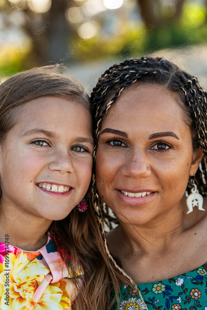 Torres Strait Islander girls face beside mother with hazel and brown ...