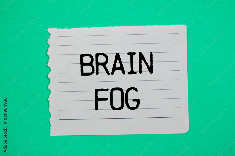 Brain fog message written on ripped torn paper piece with green ...