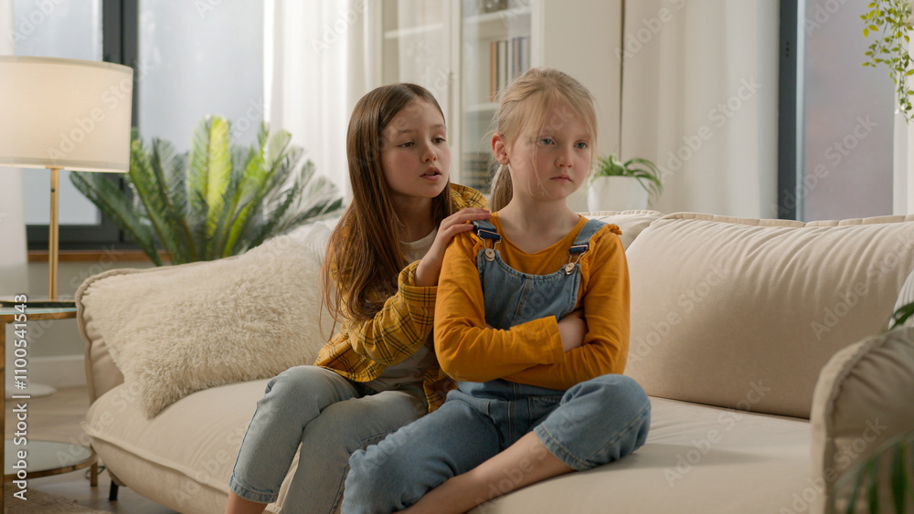 Two little Caucasian kids children siblings daughters girls argument ...
