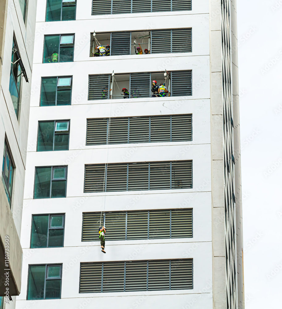 Rescue operation during a fire in a high-rise building. Firefighters ...