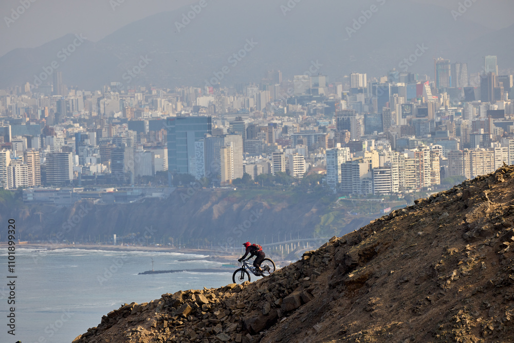 Carving down the epic trails of El Morro Solar. Whit the view of ...