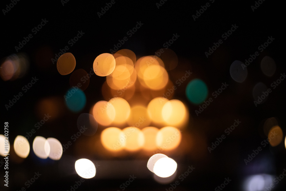 Blurry lights flicker and dance in the dark, creating an otherworldly spectacle in the city of ...