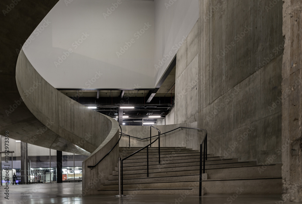A curving flight concrete spiral staircase at Blavatnik Building of ...