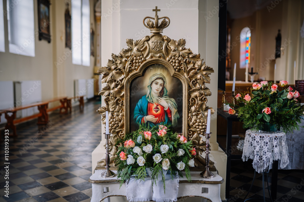 A decorative altar featuring an image of the Virgin Mary with the ...