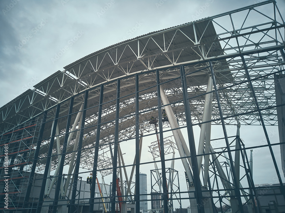 Load-bearing metal structures of industrial building. Glass and metal ...