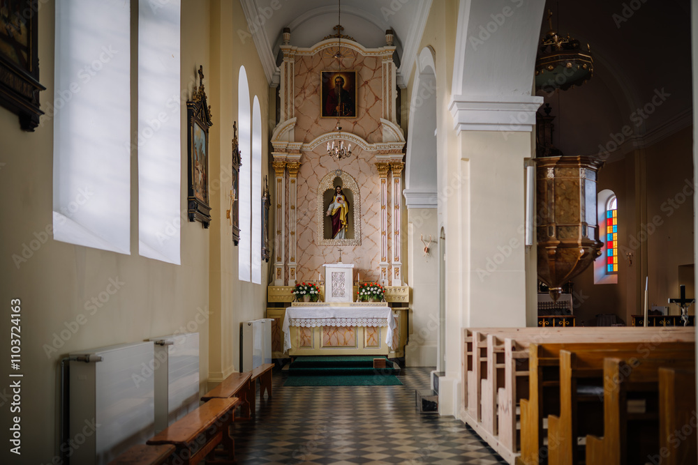A side chapel in a church featuring a statue of Jesus, marble altar ...