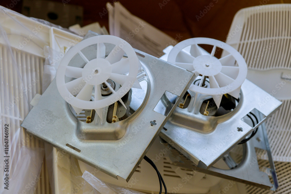 Ventilation fans are disassembled workbench in various components tools ...