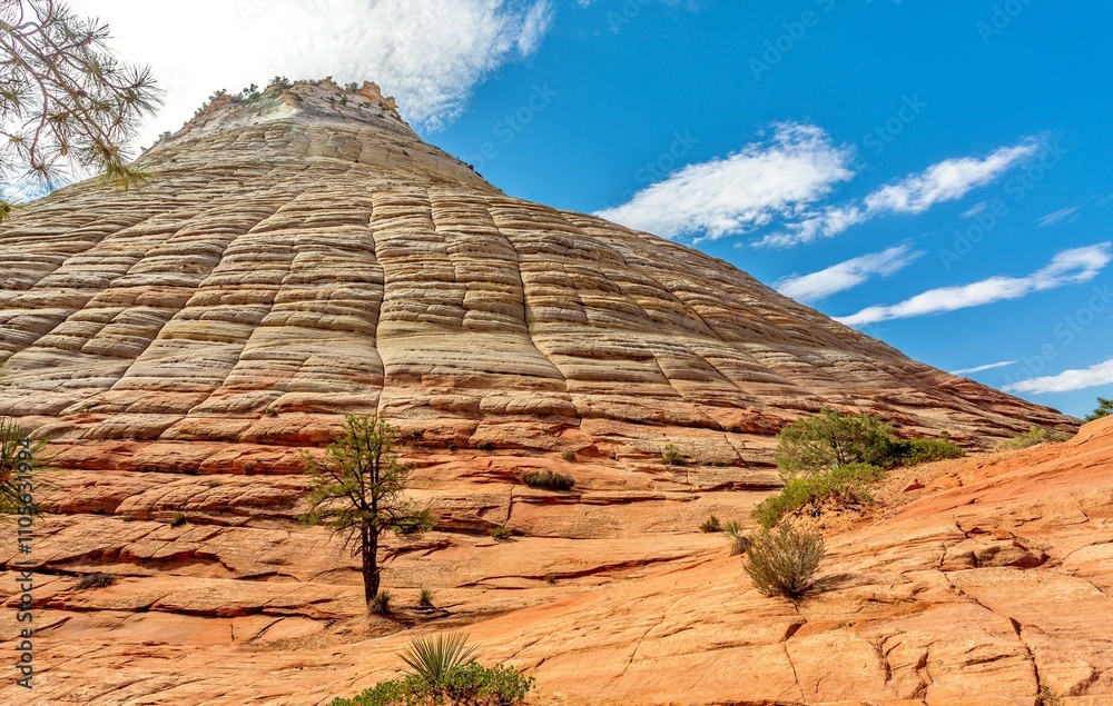 Checkerboard Mesa, a sandstone peak standing 900 feet high, in Kane ...