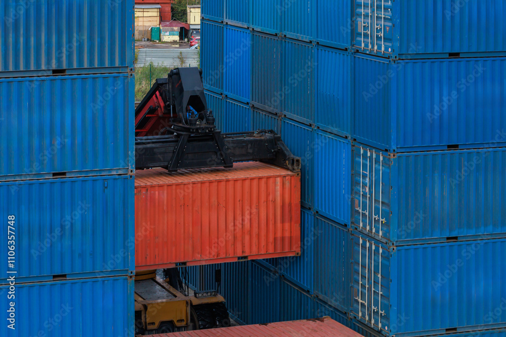 Reach stacker moves shipping container at port terminal. Stock Photo ...