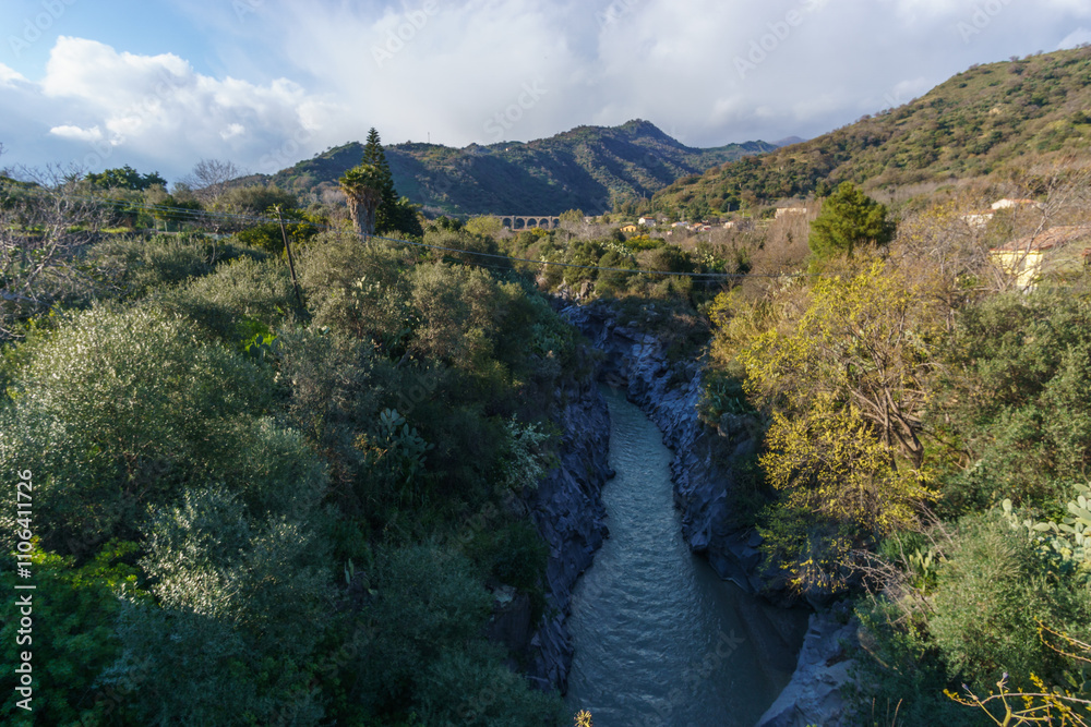 Gole dell Alcantara gorge formed by basalt columns with river near to ...