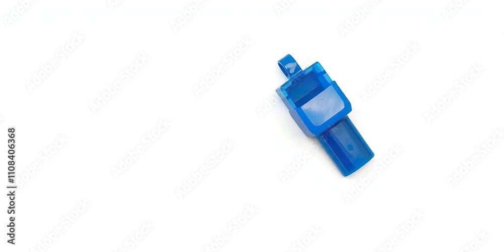 Blue plastic whistle with a glossy finish, isolated on a white ...