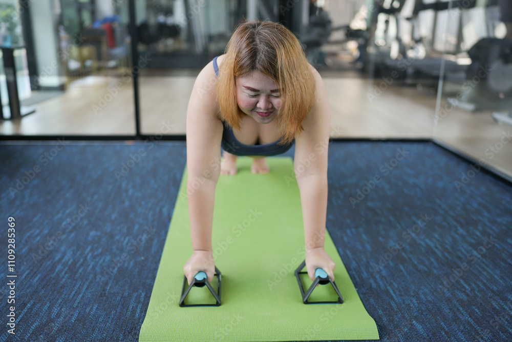 Overweight woman exercising for weight loss. plank exercise in ...