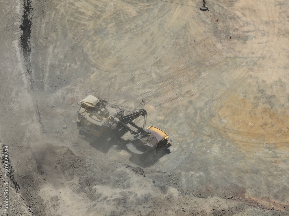 Electric Mining Shovel in Full Operation Loading Trucks at an Open-Pit ...