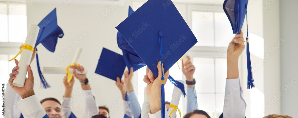 University students finish studies and celebrate graduation. Happy boys ...