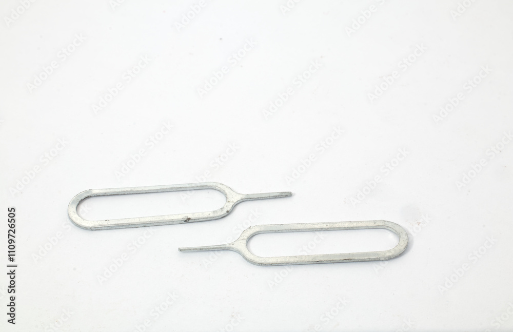 2 SIM Card Tray Removal Tools on white background. A tool commonly used ...