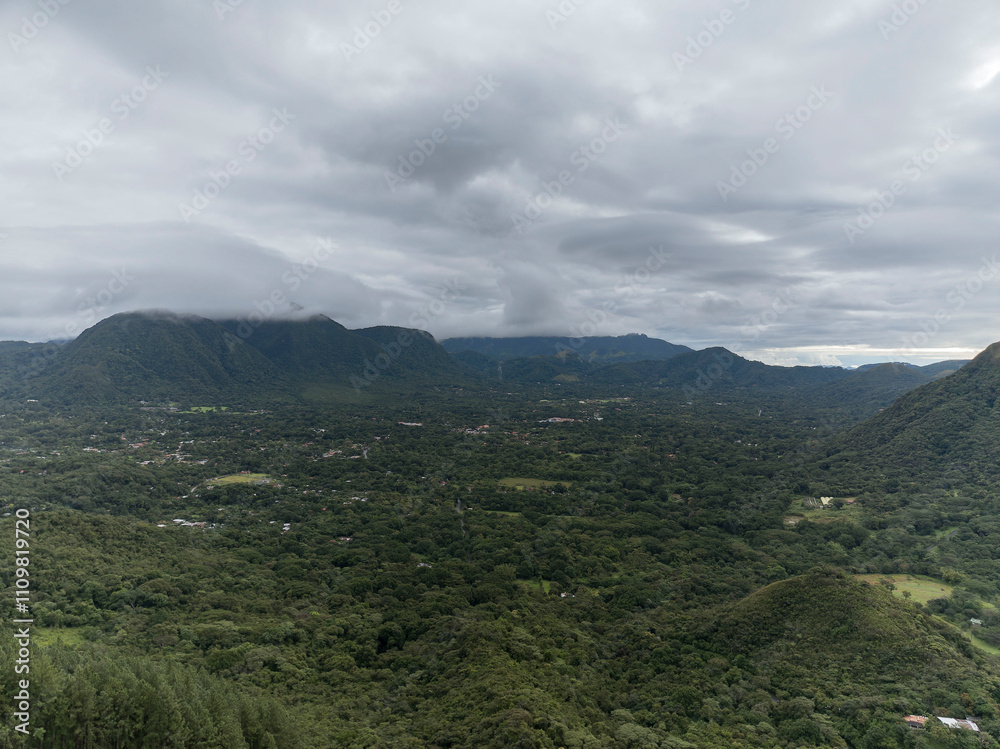 Aerial view of the Anton Valley village settled inside a huge volcano ...