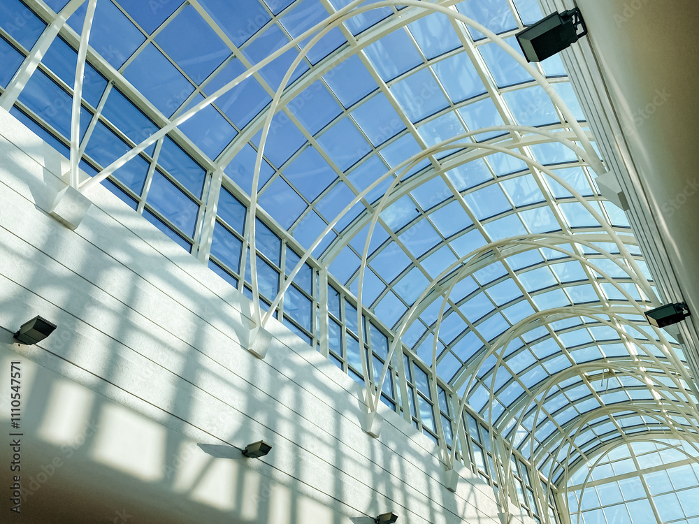 As I stand and look up at the stunning glass roof of a contemporary ...