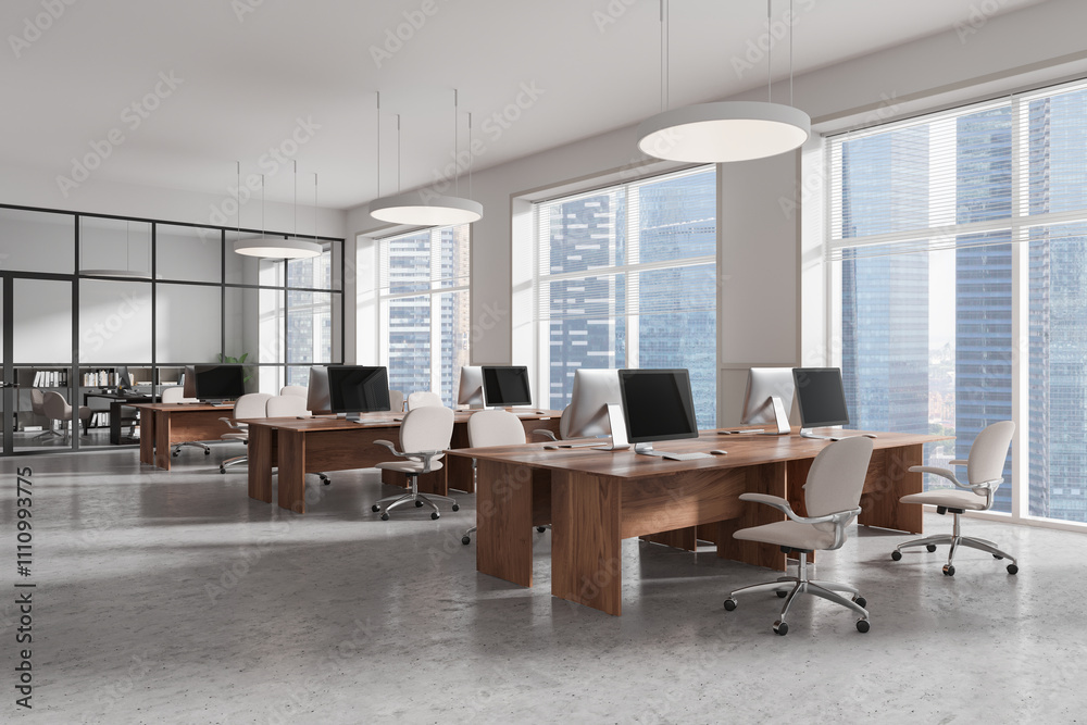 Modern open office space with wooden desks, ergonomic chairs, and large ...