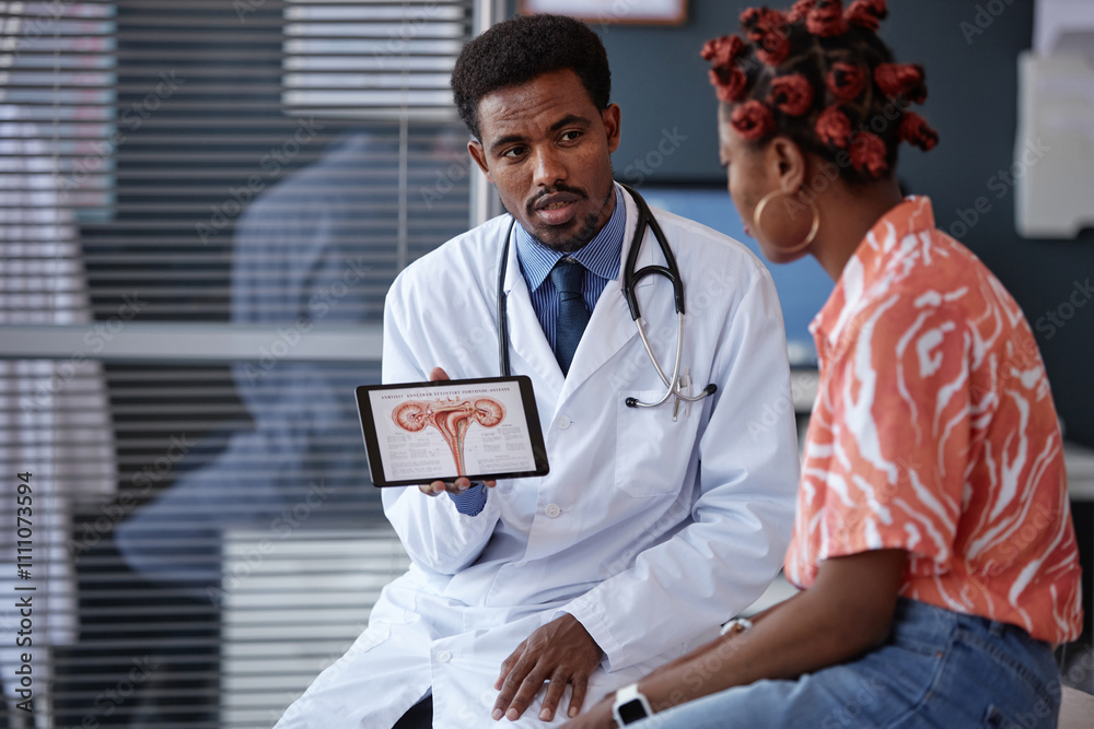 Portrait of male gynecologist wearing lab coat and holding tablet ...