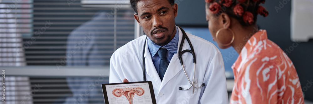 Cropped shot of male gynecologist wearing lab coat and holding tablet ...