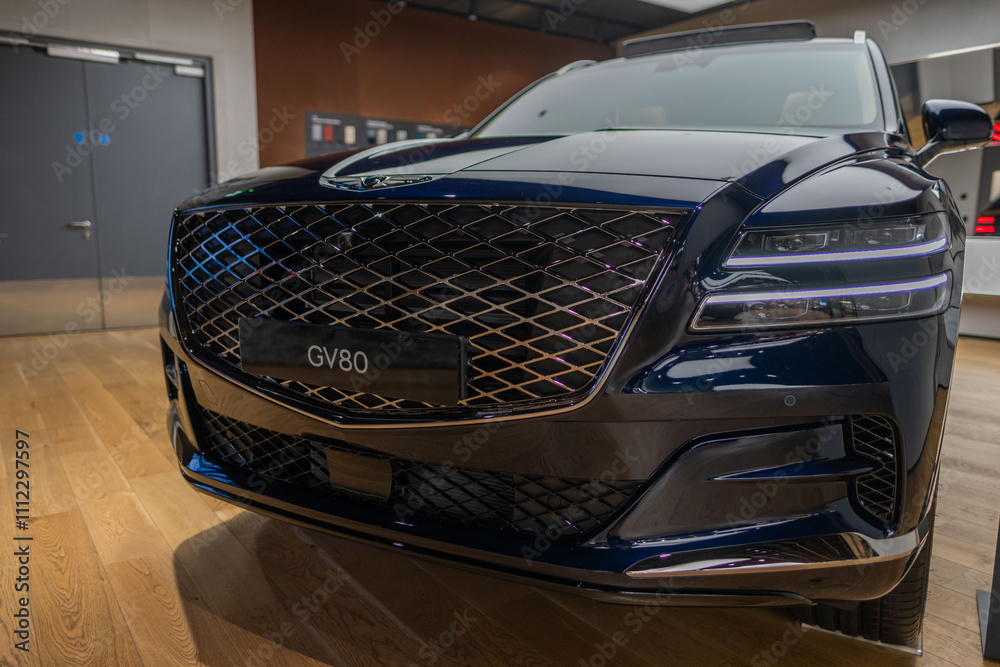 blue Genesis GV80 in stylish dealership, aerodynamic design, powerful ...