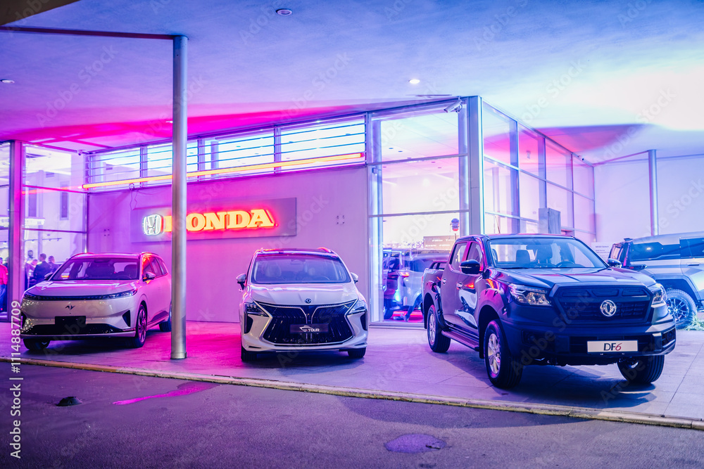 Dongfeng models displayed at a dealership with vibrant lighting ...