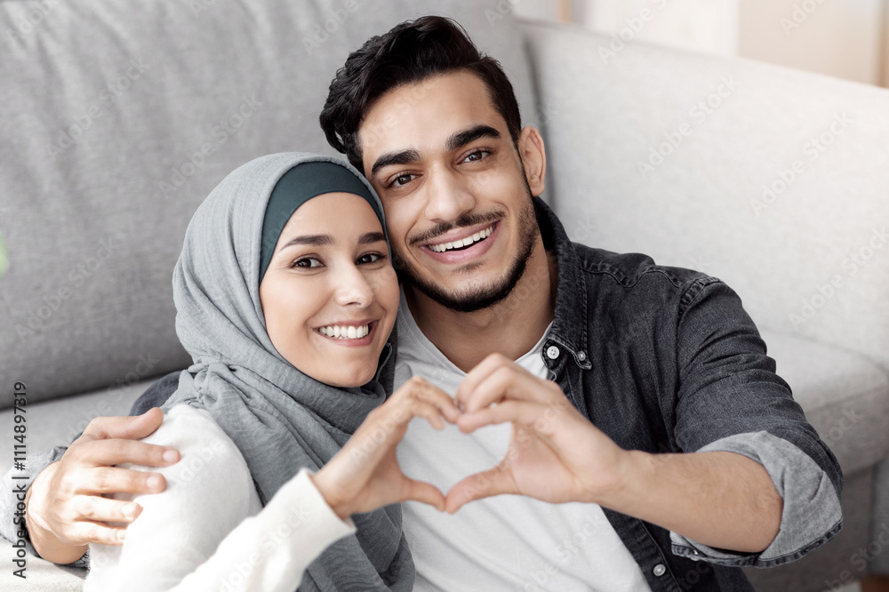 Closeup of muslim family showing heart symbol with their hands and ...