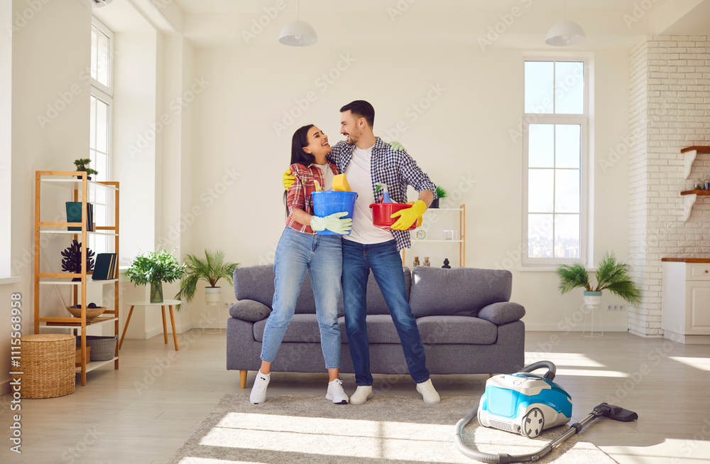 Young loving family couple hugging after cleanup at home. Affectionate ...