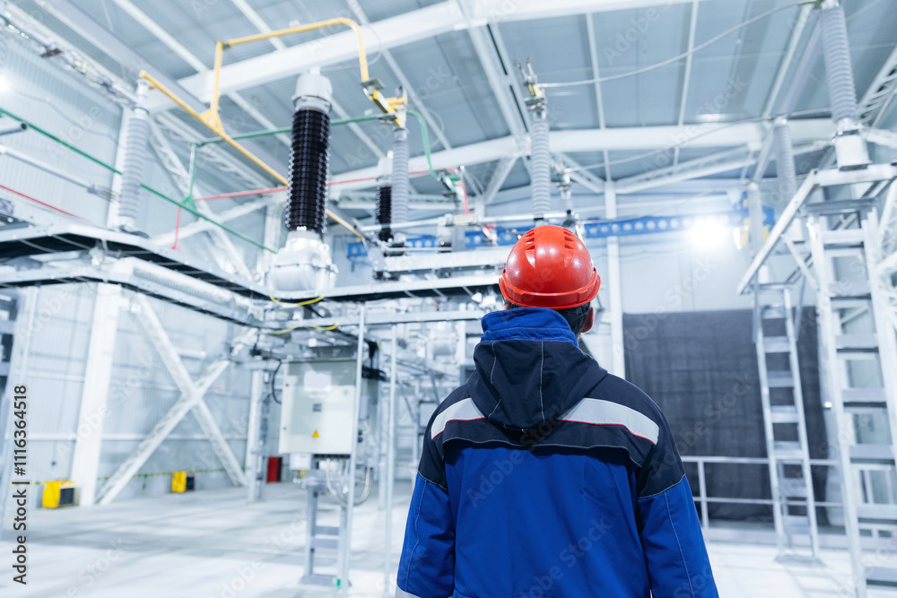 Concept Power plant maintenance. Electrical engineer worker inspects ...