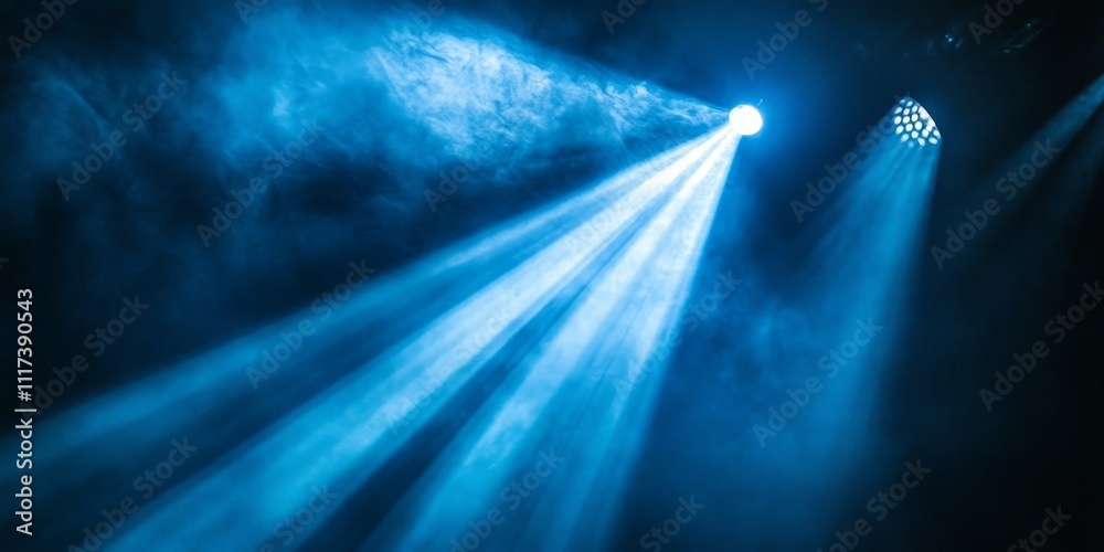 Blue light beam effect created by a spotlight or projector offers a ...
