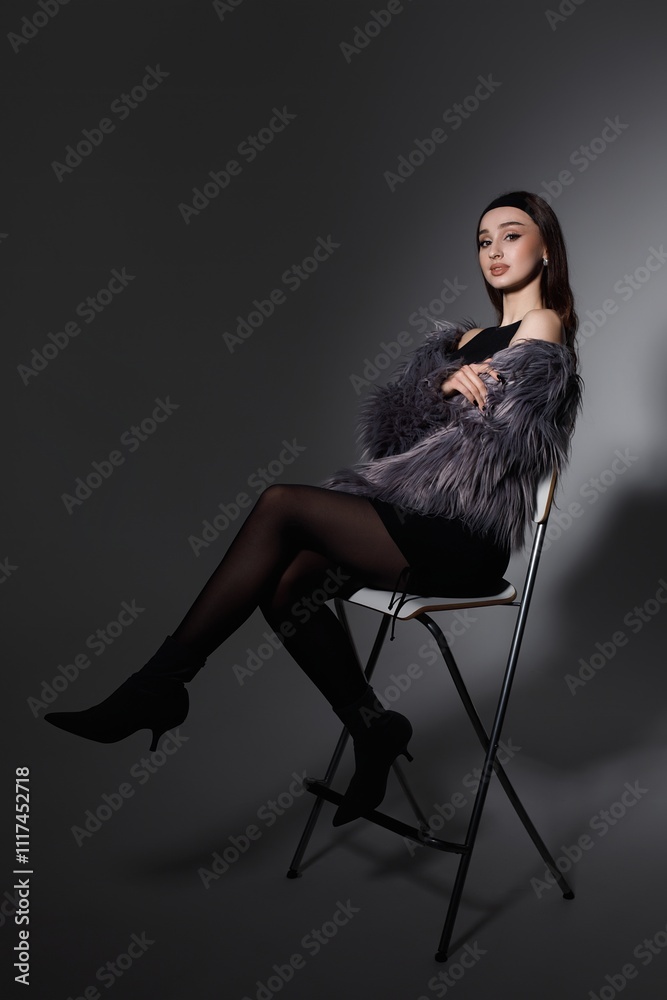 girl in the studio with long brown hair falling freely on her shoulders ...
