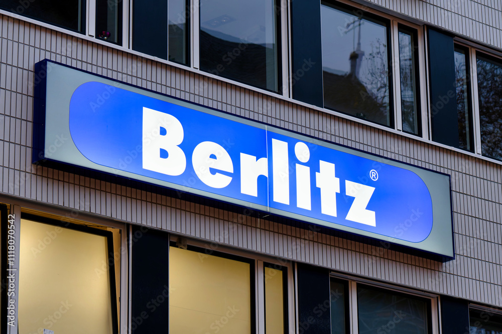 Cologne, Germany, December 04 2024: illuminated Berlitz advertising ...
