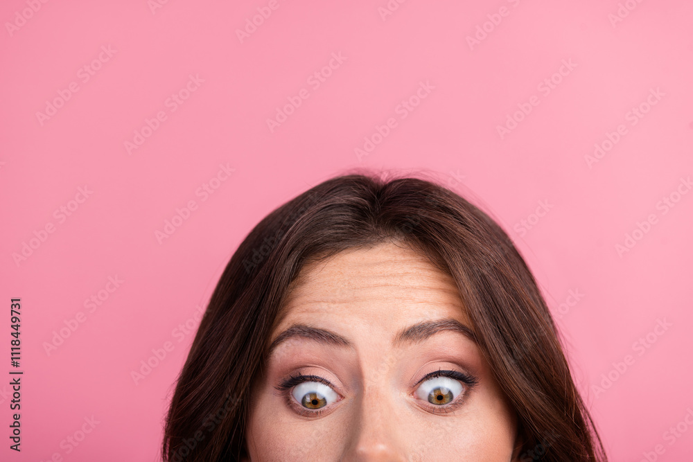 Surprised young woman on pink background showing expressive eyes and ...