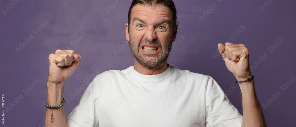 feeling serious, strong and rebellious, raising fist up, protesting or ...