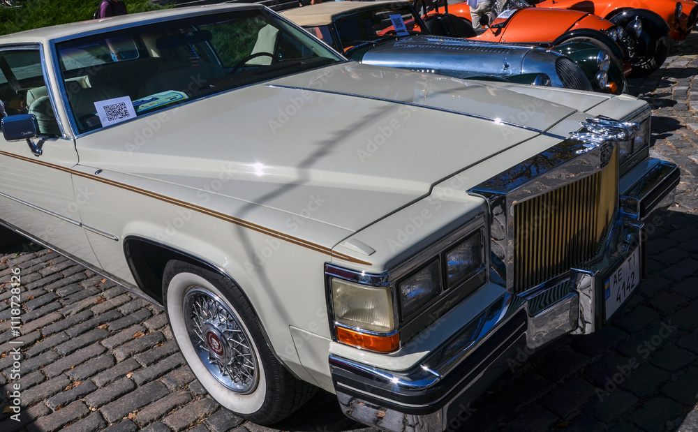 Luxurious iconic white sedan 1990 Cadillac DeVille that exemplifies ...