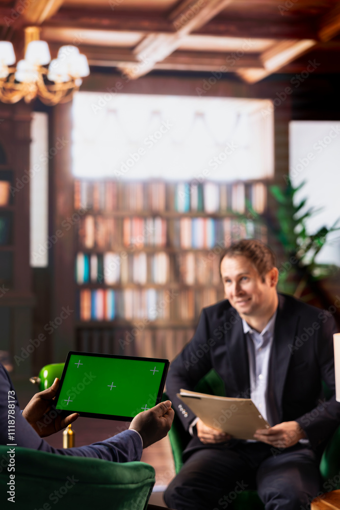 Two secret agents examine evidence at CIA secret base with a green ...