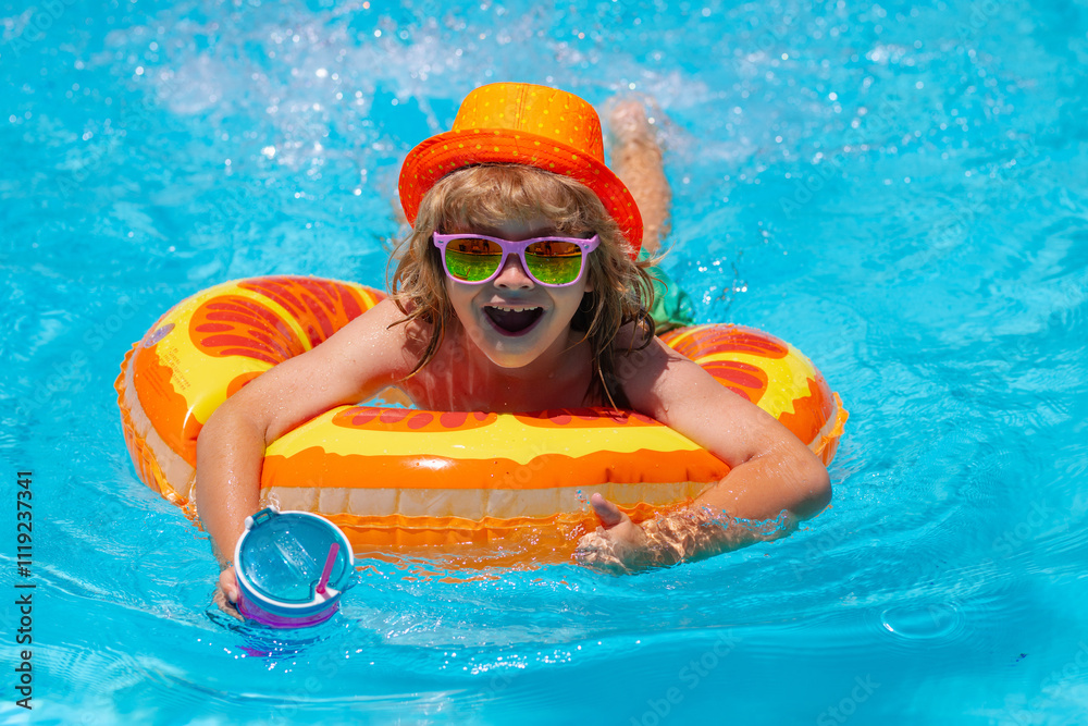 Excited kids face. Kid boy in swimming pool on inflatable ring ...