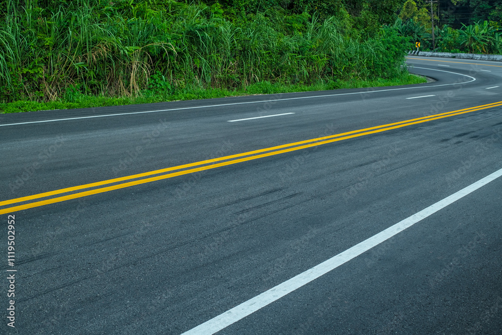 Side view of asphalt road over the hills with the forest and beautiful ...