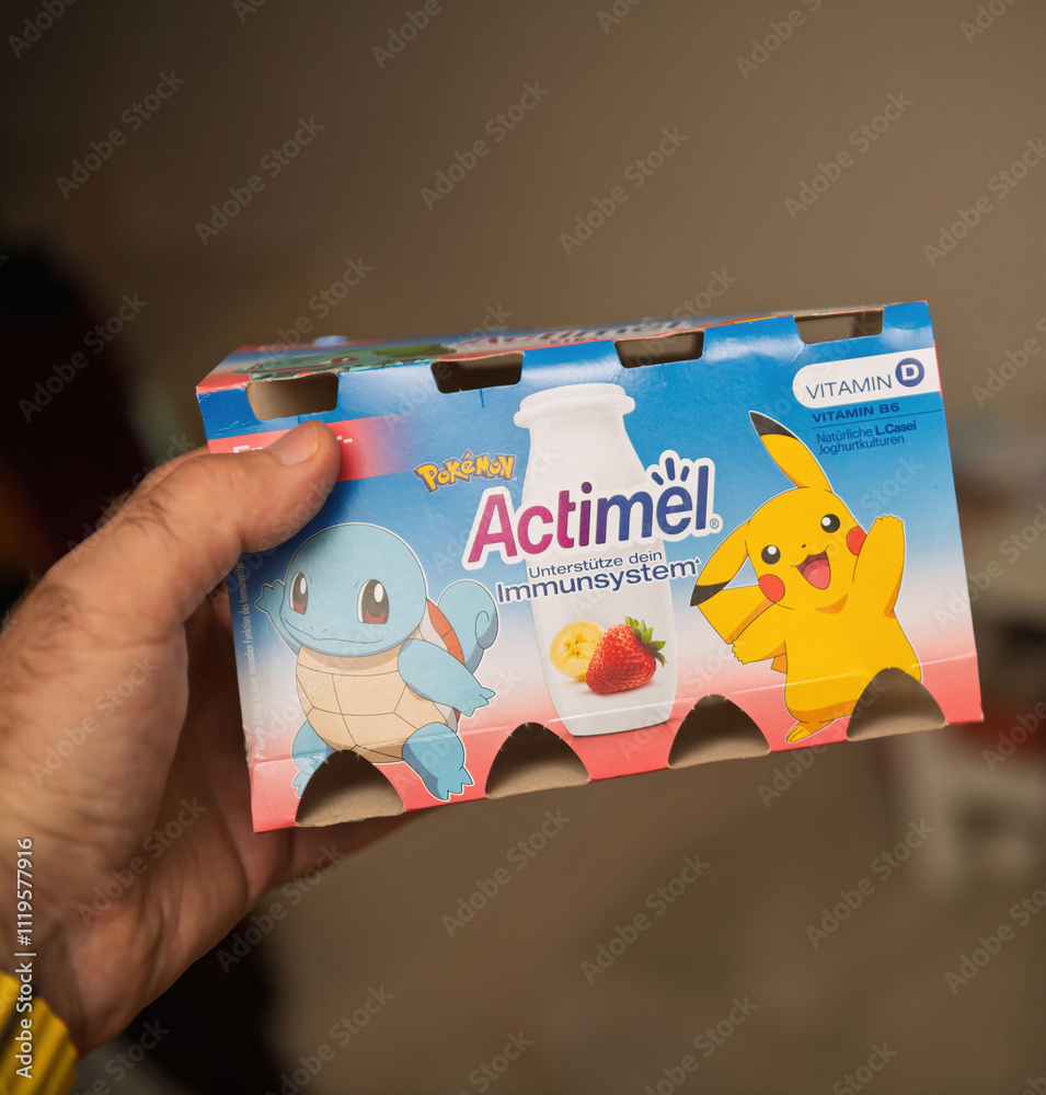 Frankfurt, Germany - Aug 22, 2024: Hand holds a pack of Actimel yogurt ...