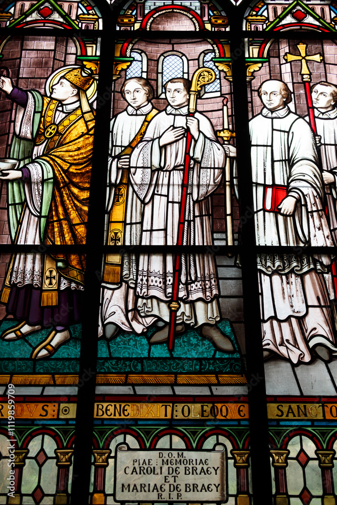 Stained glass window depicting religious figures, likely commemorating ...