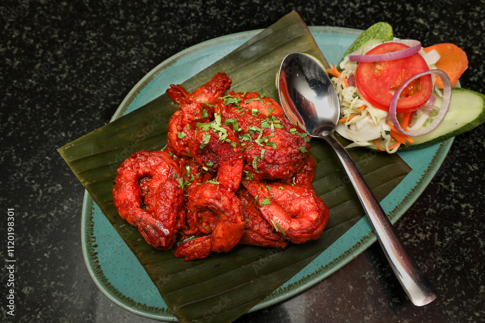 Top view spicy red hot Goa Goan Tiger Prawns roast shrimp masala fish ...