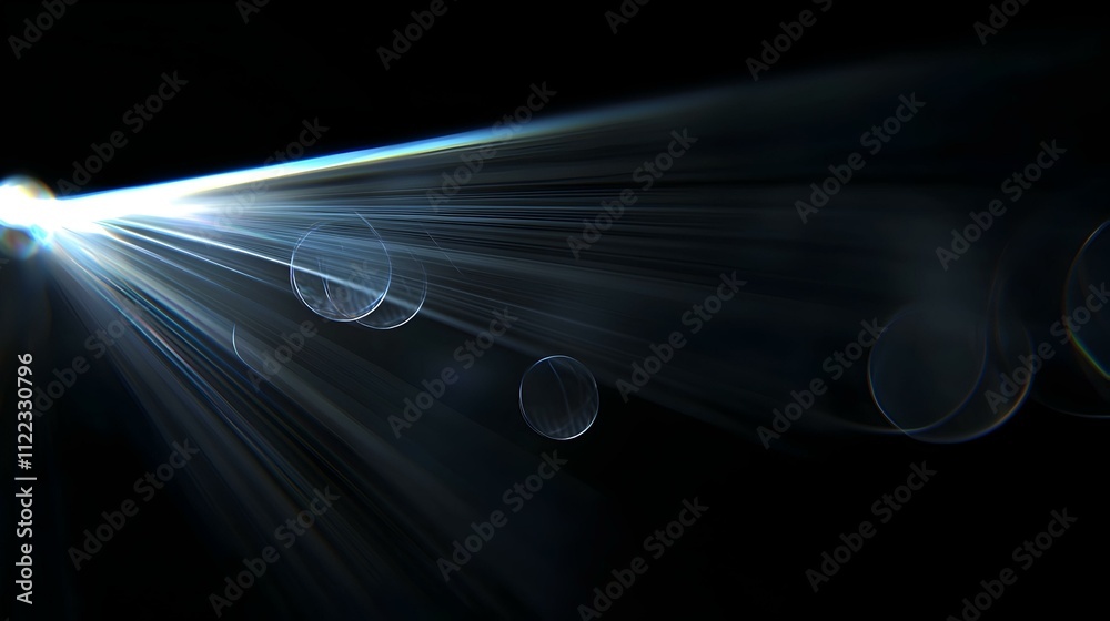 Abstract light rays and lens flare on black background. Perfect for ...