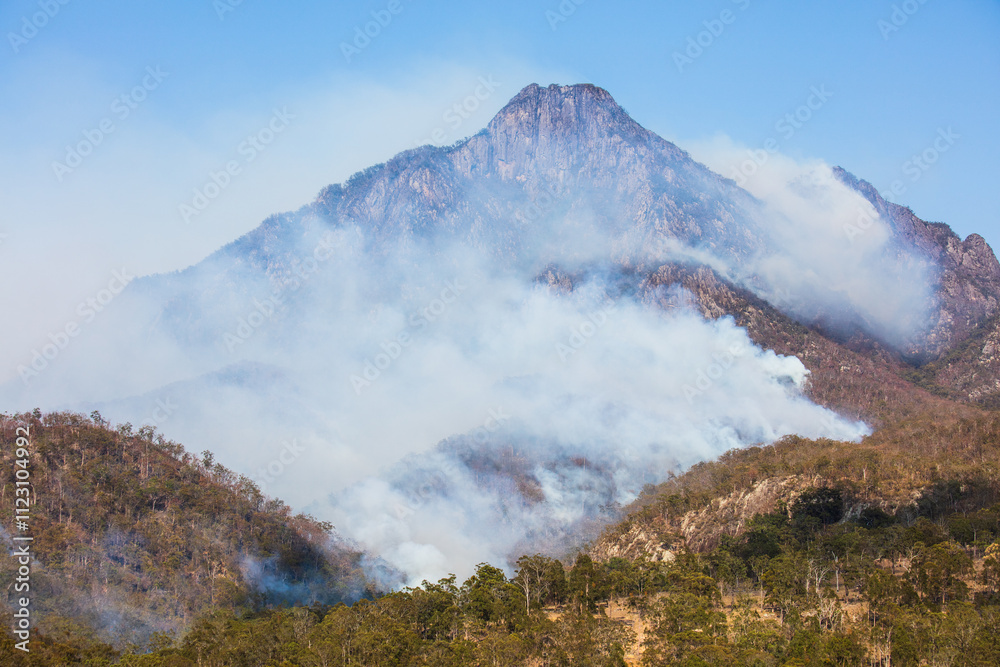 Bushfire smoke from a wildfire surrounds Mt Barney in the Scenic Rim ...
