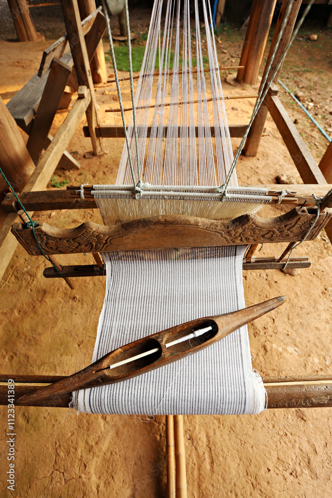 The ancient weaving loom in an interior of a wooden log hut, Important ...