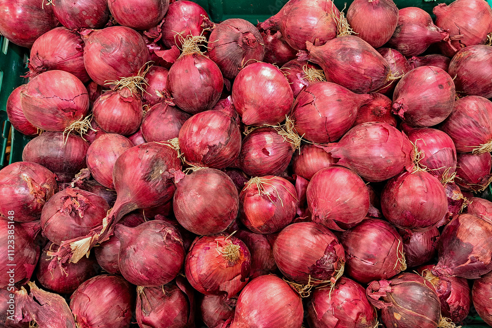 Many Red Onions on Display in Supermarket Produce Bin background Stock ...