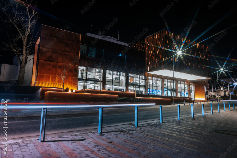 Valmiera Drama Theatre building illuminated with warm golden lights on ...