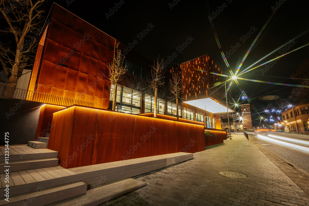 Valmiera Drama Theatre building illuminated with warm golden lights on ...
