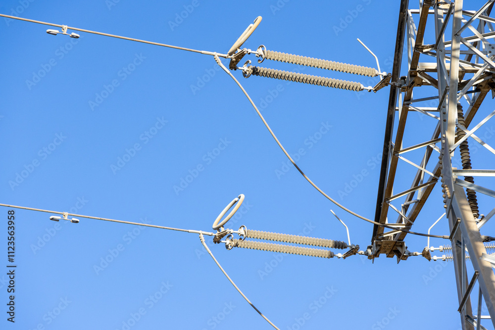 High voltage power lines and ceramic insulators connecting cables to ...