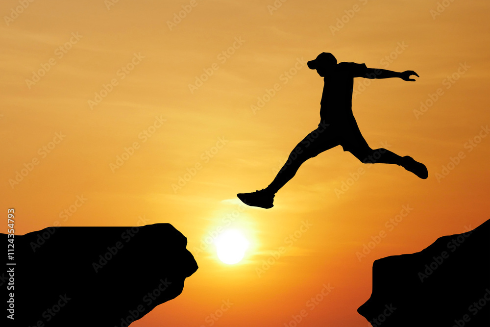 Sunset Leap of Faith: Silhouette of a determined person making a daring ...