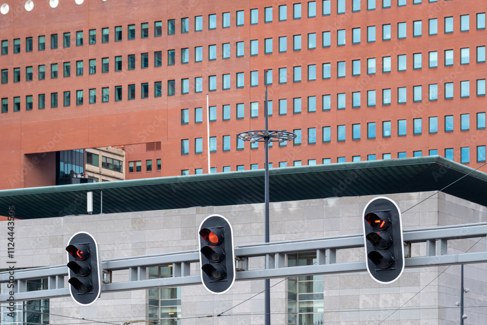 The image captures a row of traffic lights in focus, set against a ...